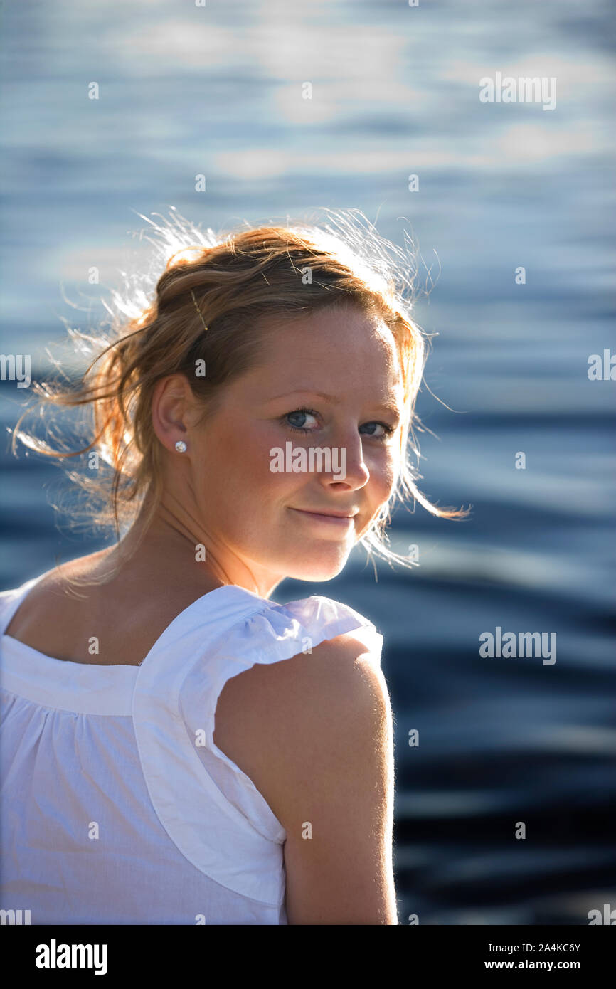 Portrait of woman by the sea Stock Photo - Alamy