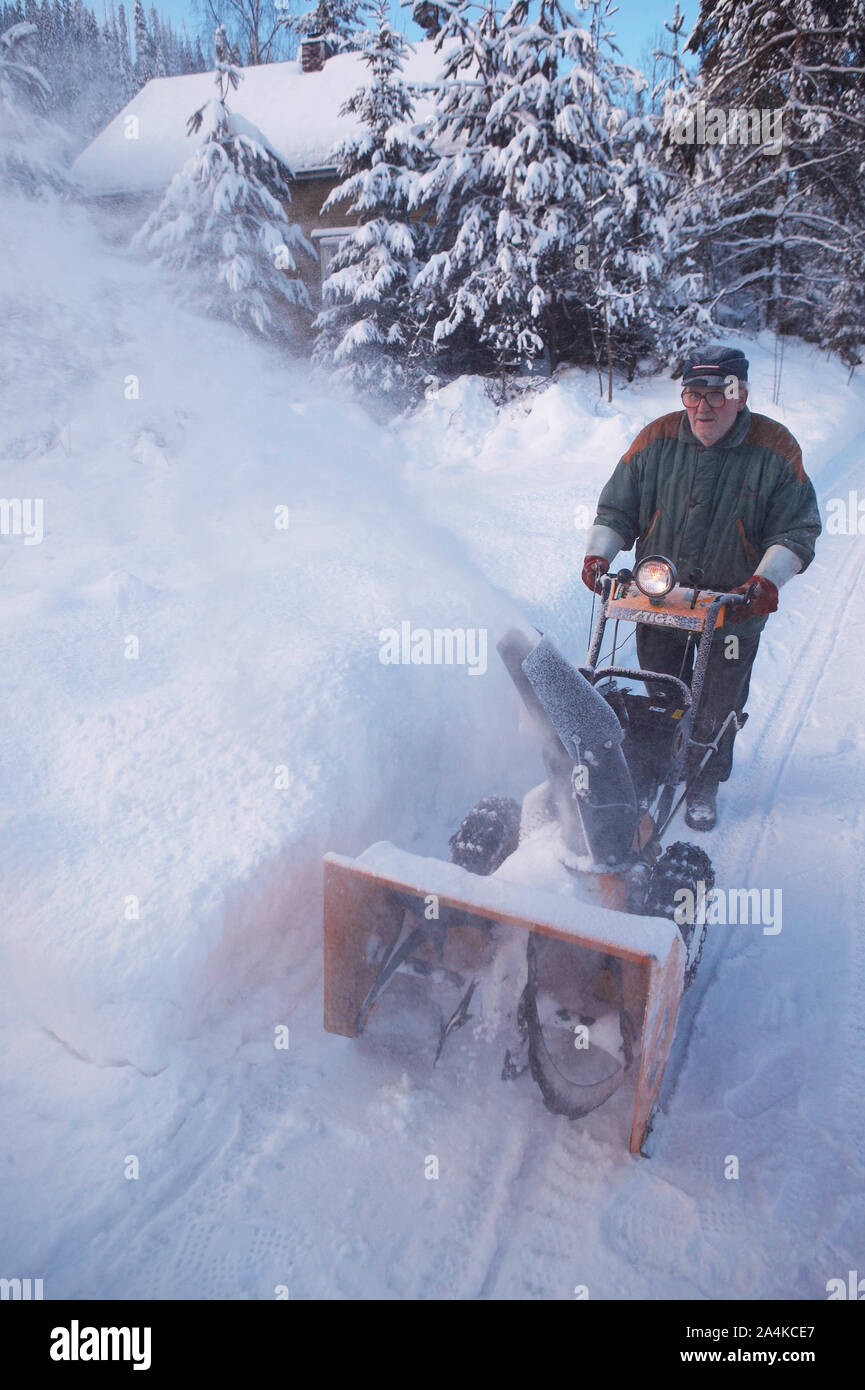 Old man using snow blower/snowblower Stock Photo - Alamy