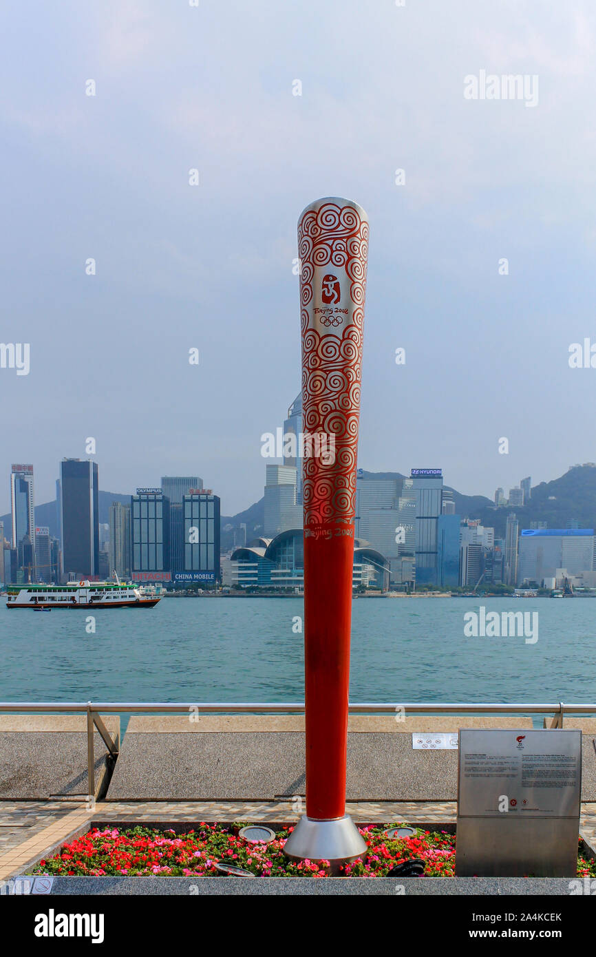 Monument of Olympic Games. On Avenue of Stars near promenade. Skyline ...