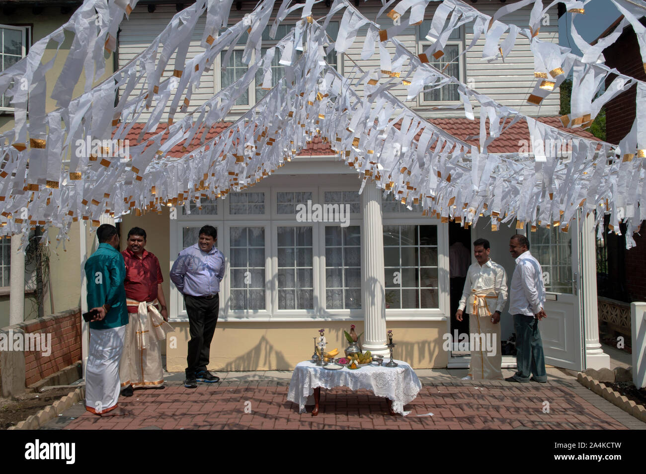 Hindu immigrant family decorate suburban exterior of their family home ...