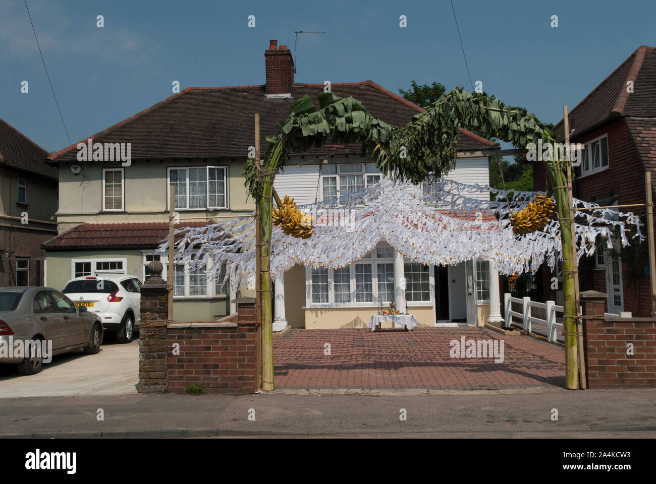 Hindu immigrant family decorate suburban exterior of their family home ...