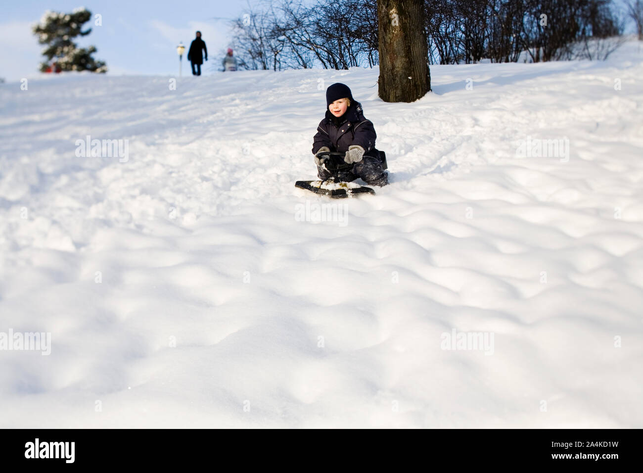 Boys on sledges hi-res stock photography and images - Alamy