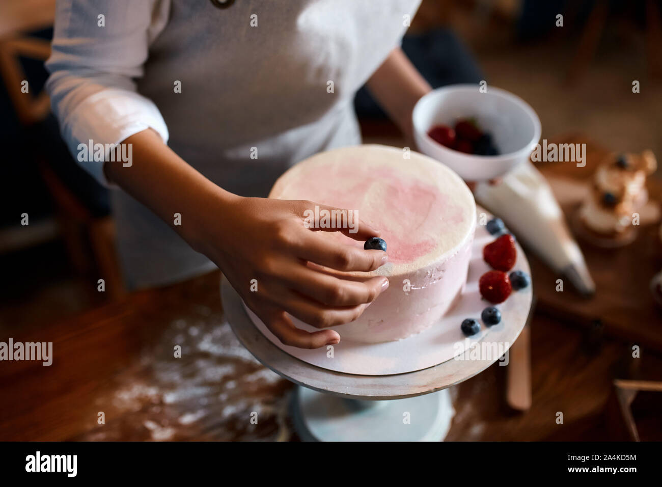 young professional cook showing master class in the kitchen. close up ...