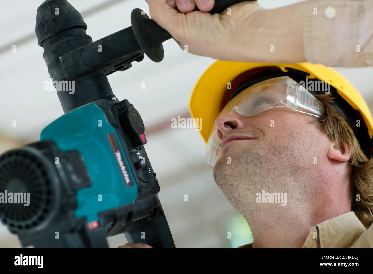 Builder in hard hat Stock Photo - Alamy