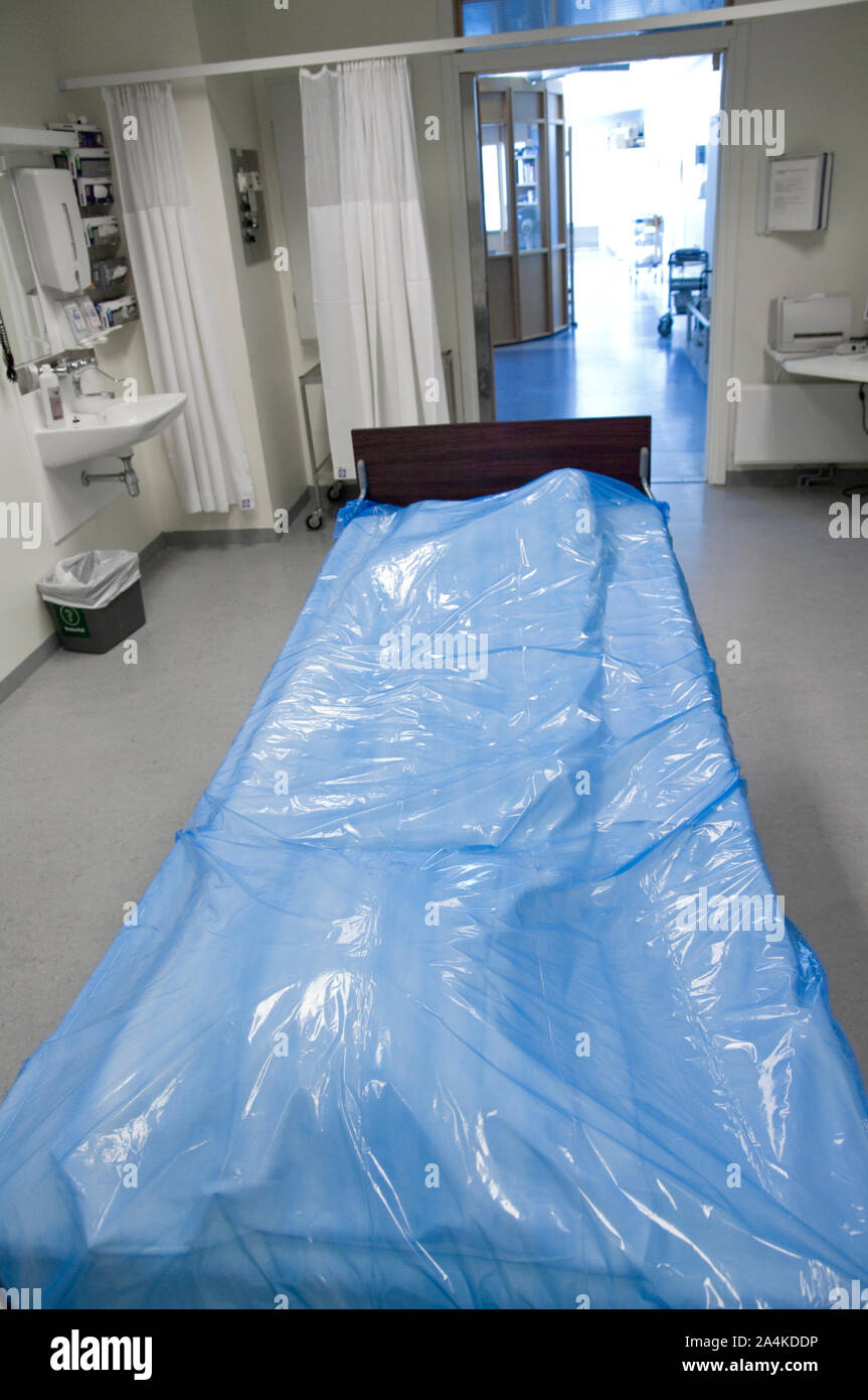 Hospital bed covered with plastic Stock Photo - Alamy