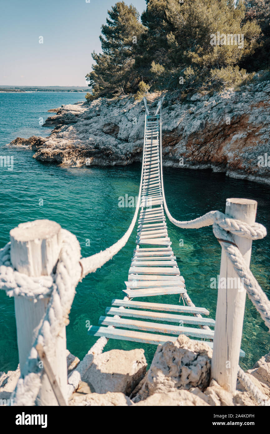Rope bridge over a cliff in Punta Christo, Pula, Croatia - Europe ...