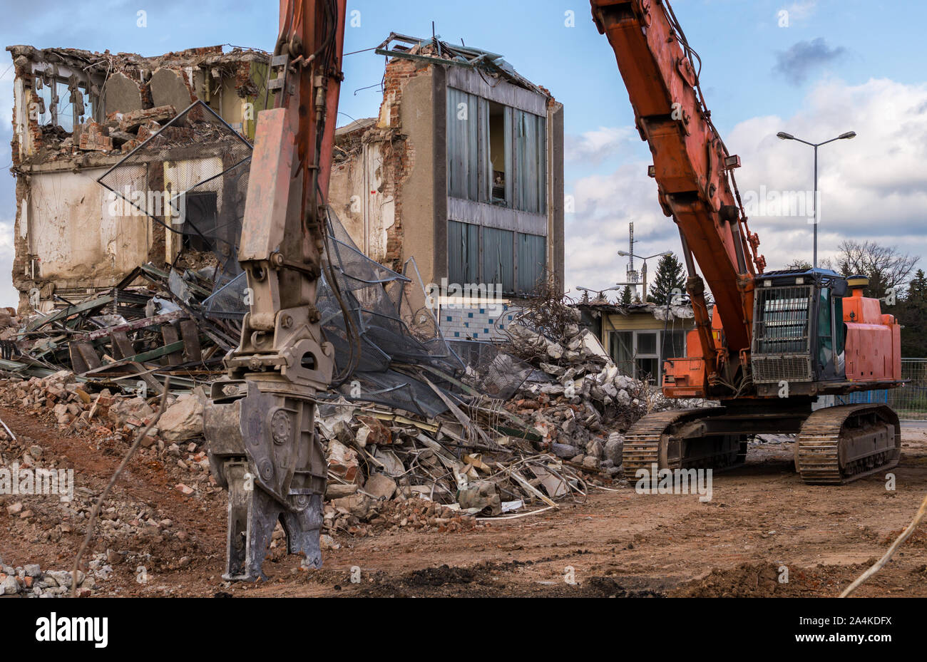 Excavator during demolition work Stock Photo - Alamy