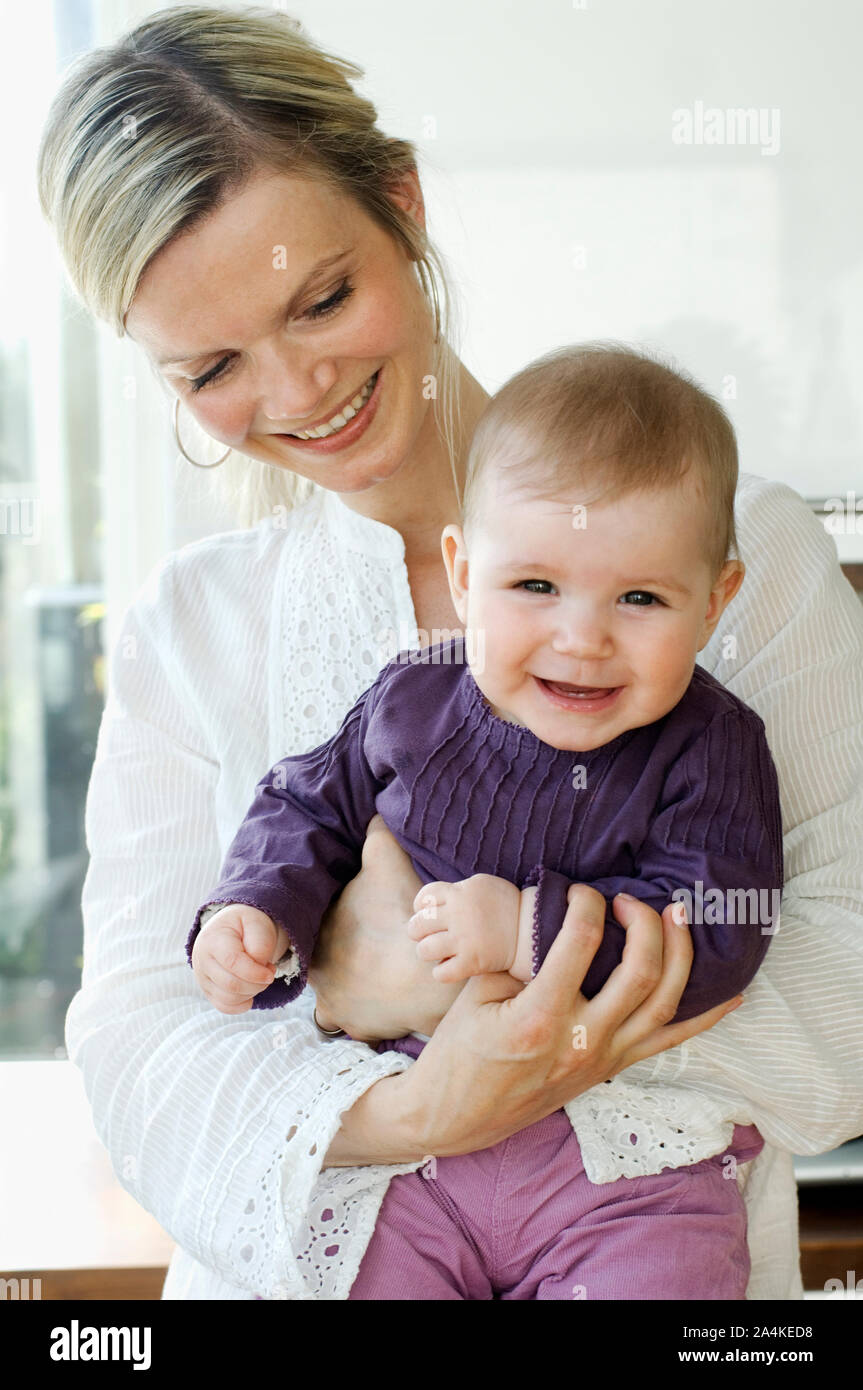 Mother and baby at home Stock Photo - Alamy
