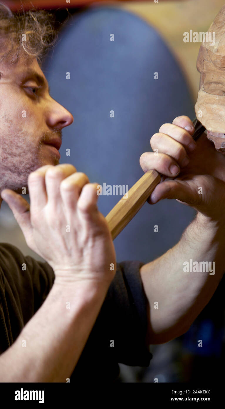 Woodcarving - wood carver Stock Photo - Alamy