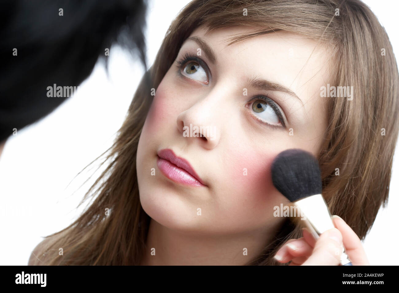 Girl being made up Stock Photo - Alamy