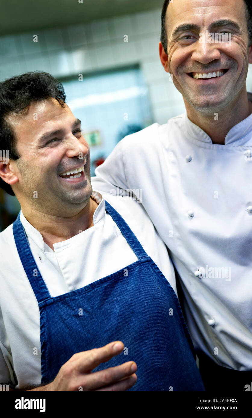Two cooks with aprons Stock Photo - Alamy
