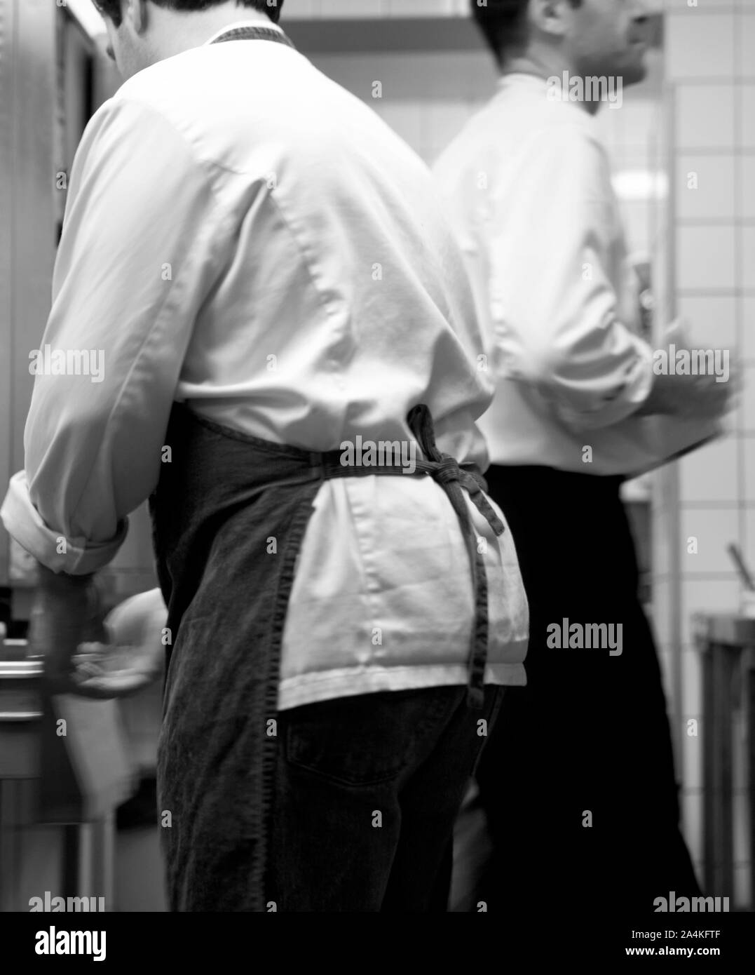 Hands working on two Black and White Stock Photos & Images - Alamy