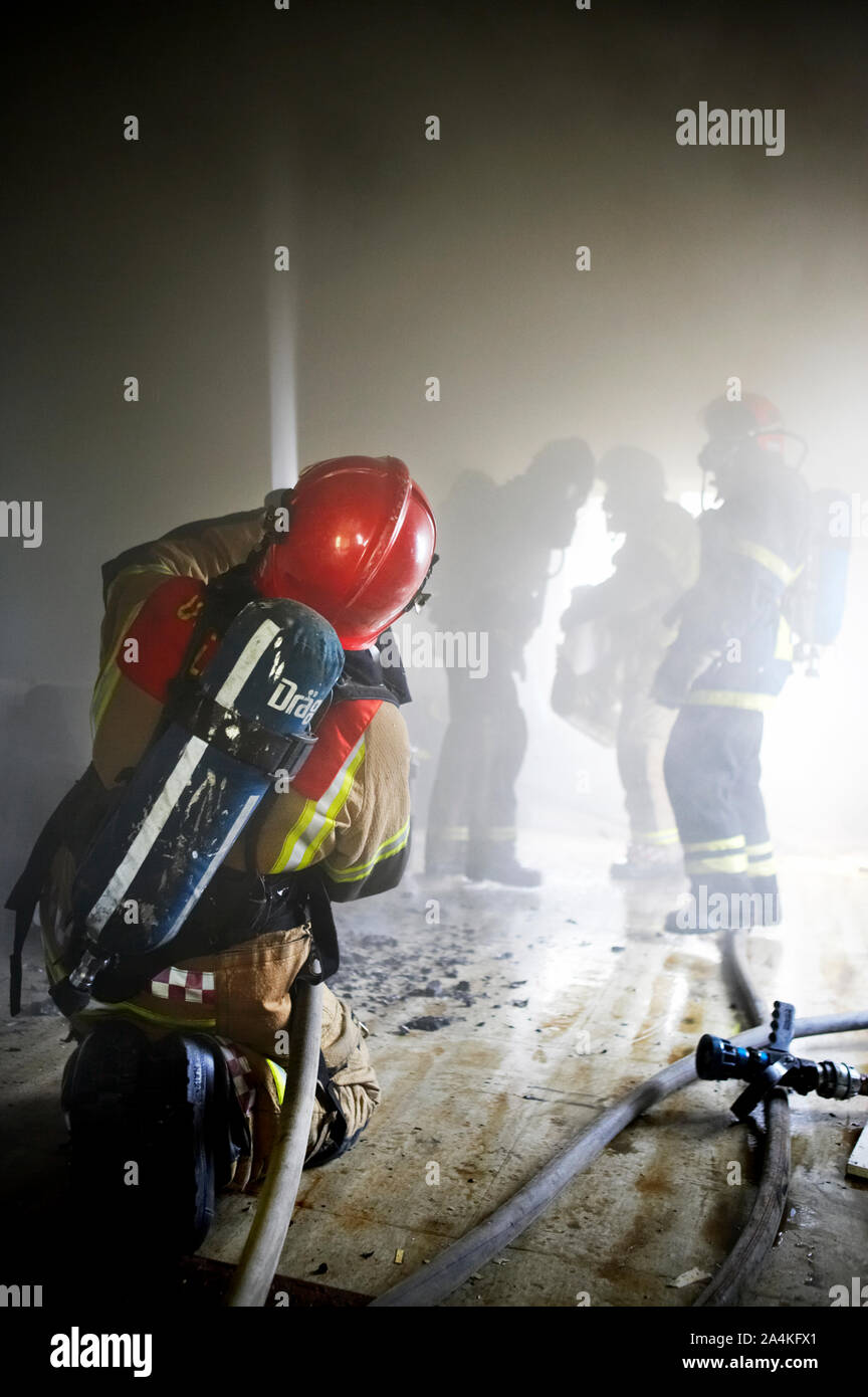 Fire men. Fire drill - oxygen tank Stock Photo - Alamy