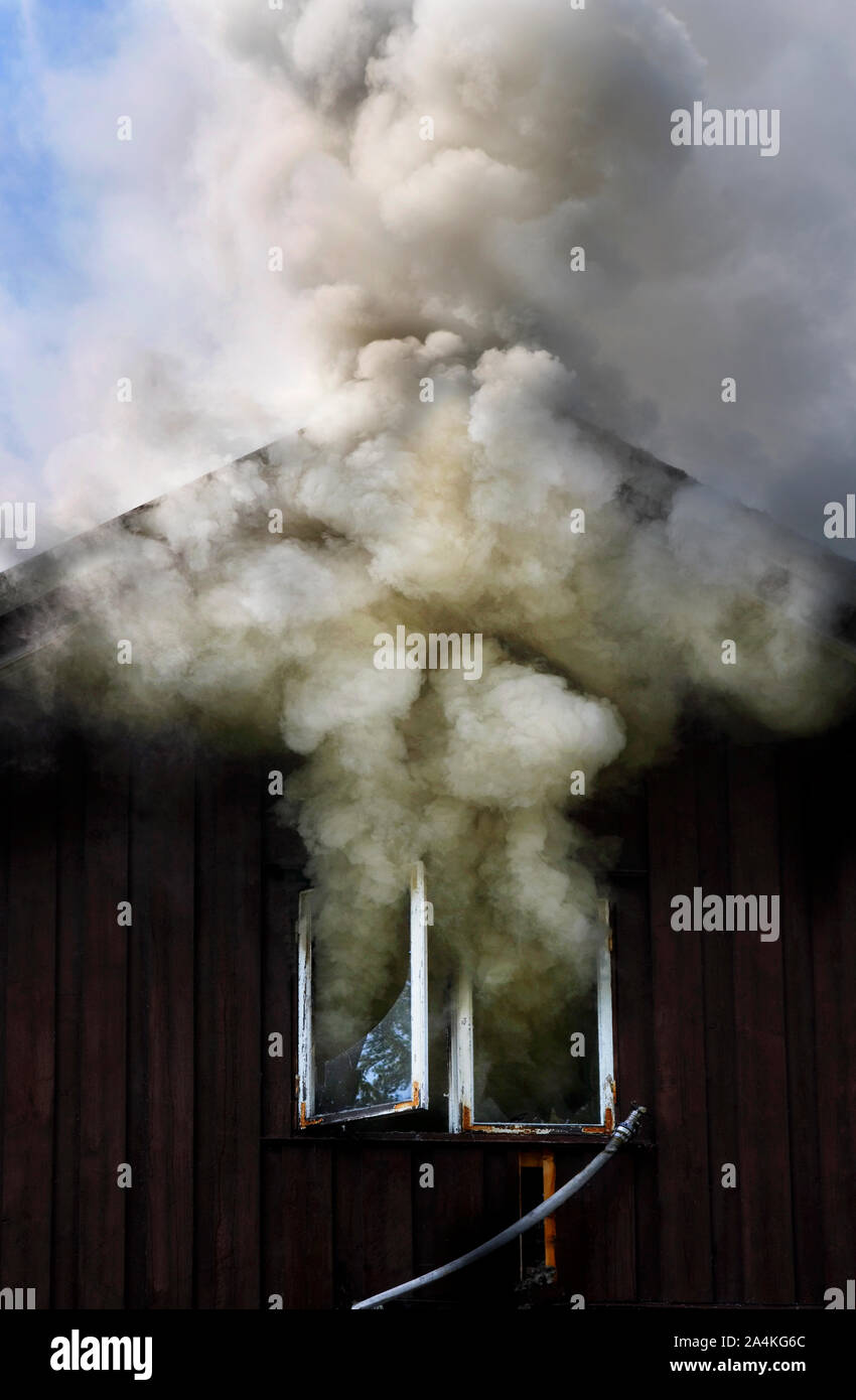 Smoke from a window Stock Photo - Alamy