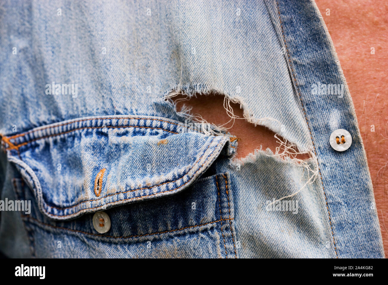 Worn out denim shirt. Ragged, tattered, frayed Stock Photo - Alamy