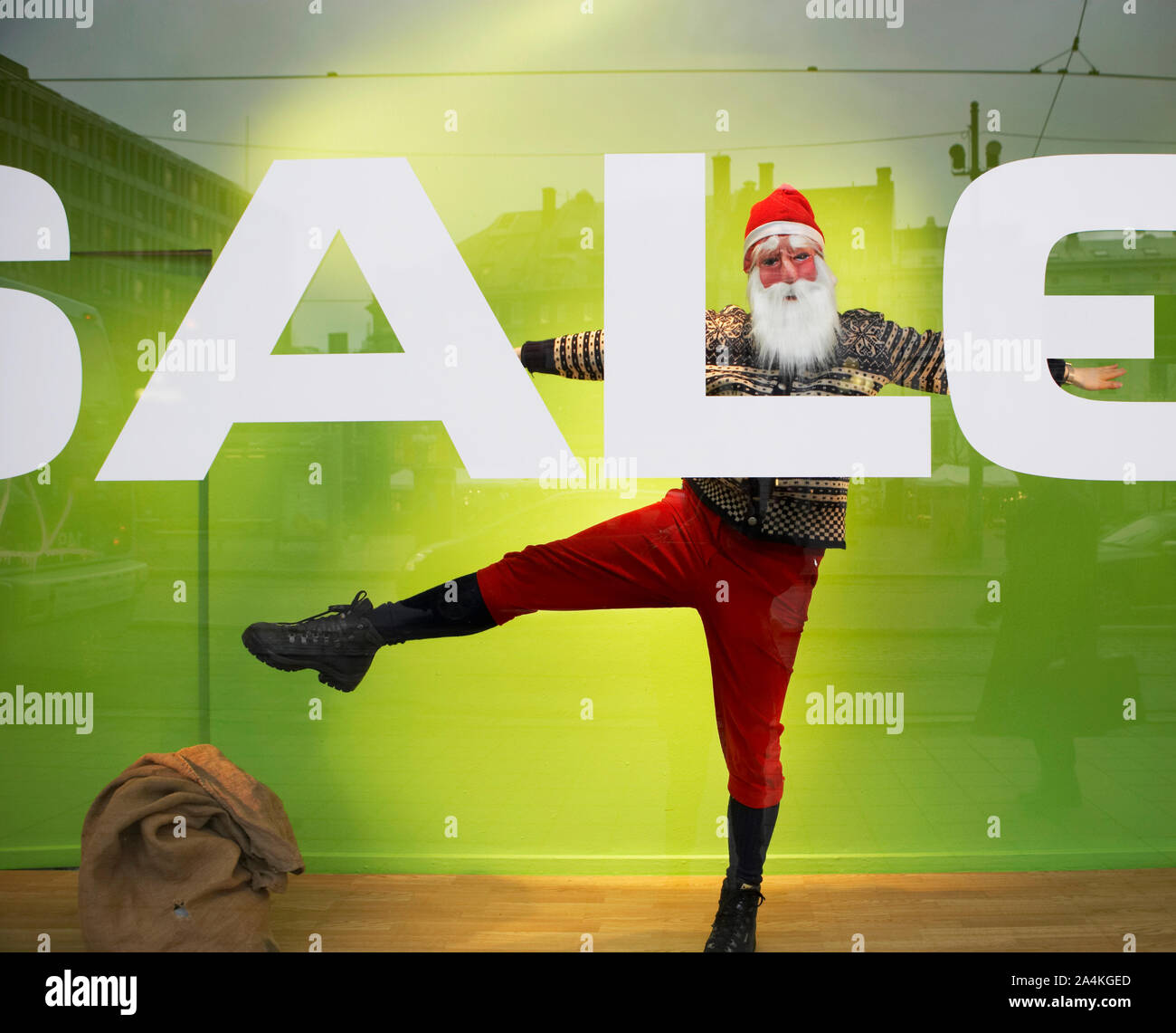 Santa Claus in a shop sale window Stock Photo - Alamy
