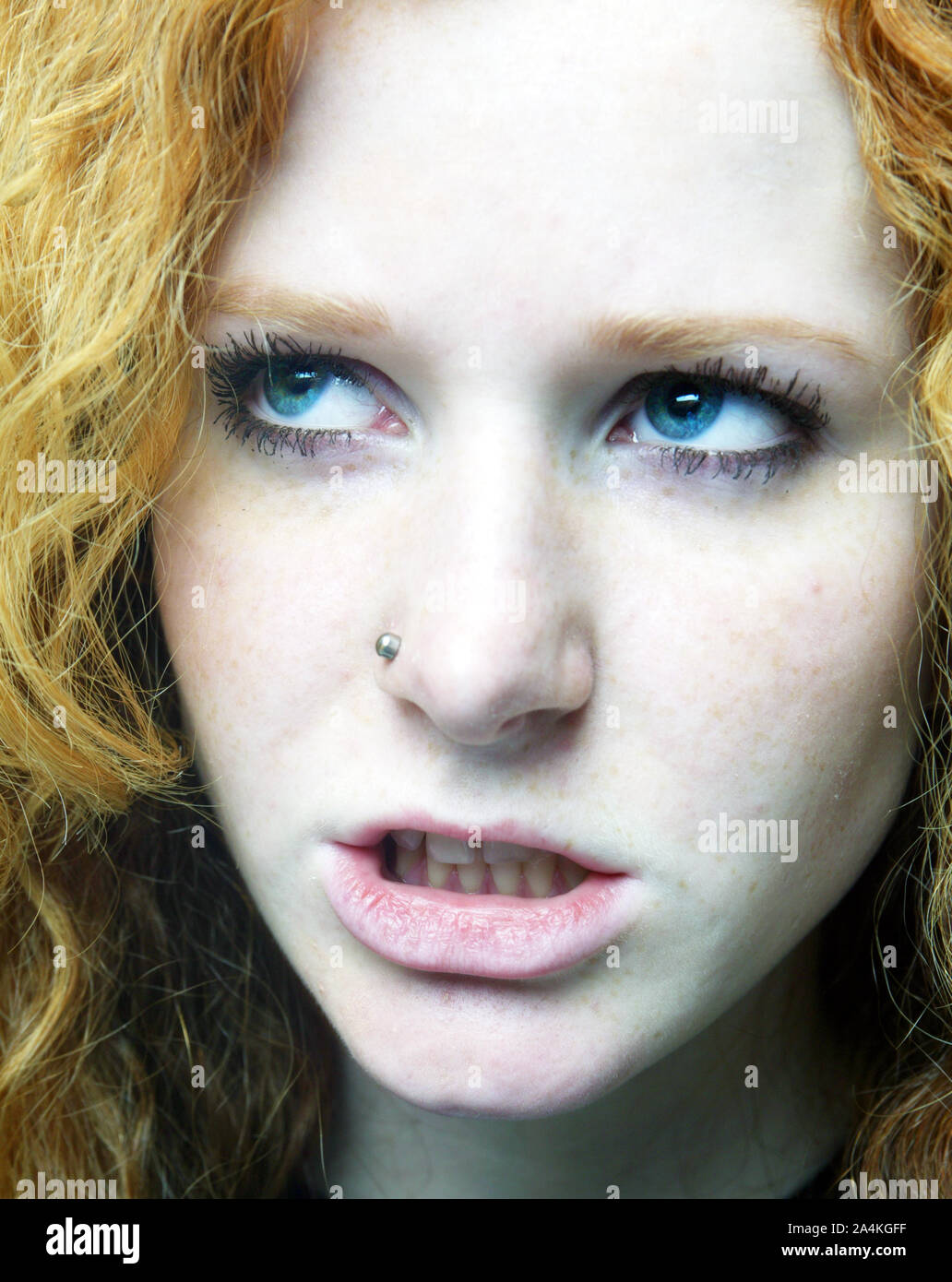 Angry lady with red hair and blue eyes - looking up Stock Photo - Alamy