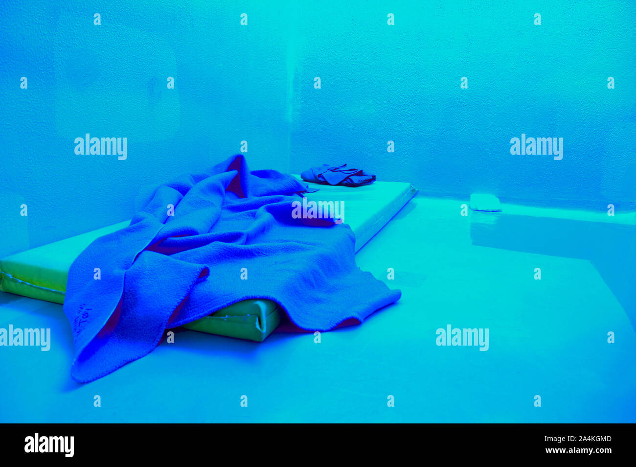 Padded cell with a mattress - psychedelic loneliness Stock Photo - Alamy