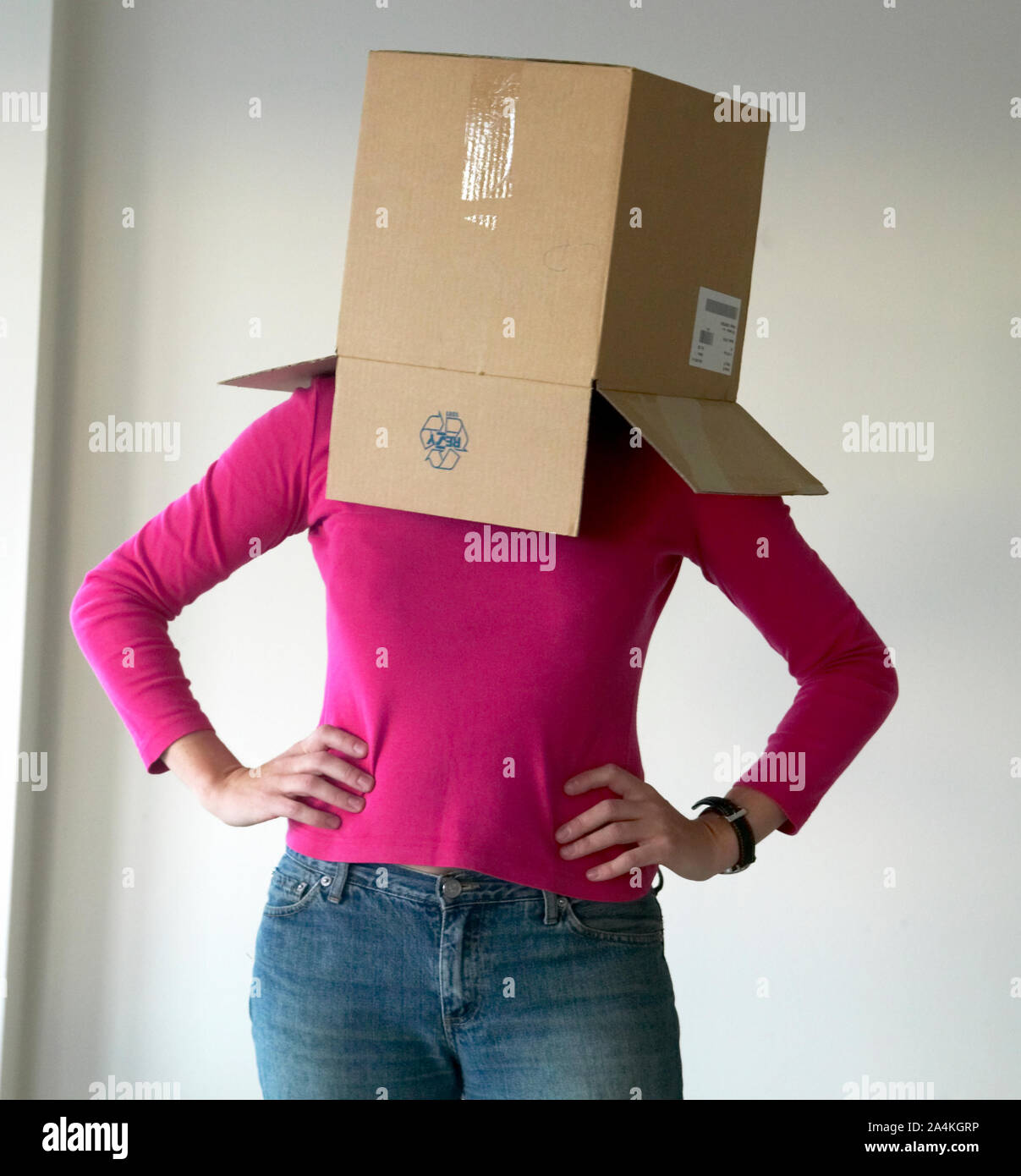 A woman is fed up by filling up carton boxes Stock Photo - Alamy