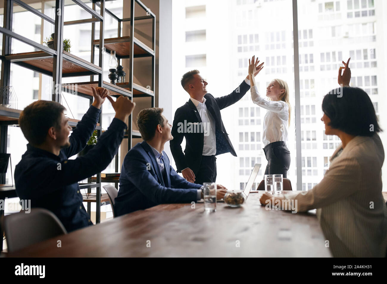 Successful team business partners rejoicing hi-res stock photography ...