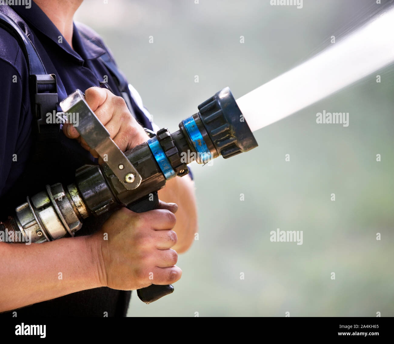 Fireman. Fire hose Stock Photo - Alamy
