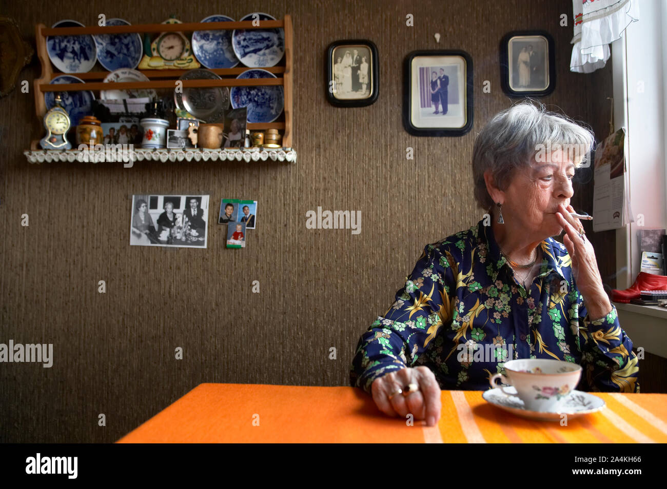Woman smoking in kitchen hi-res stock photography and images - Alamy