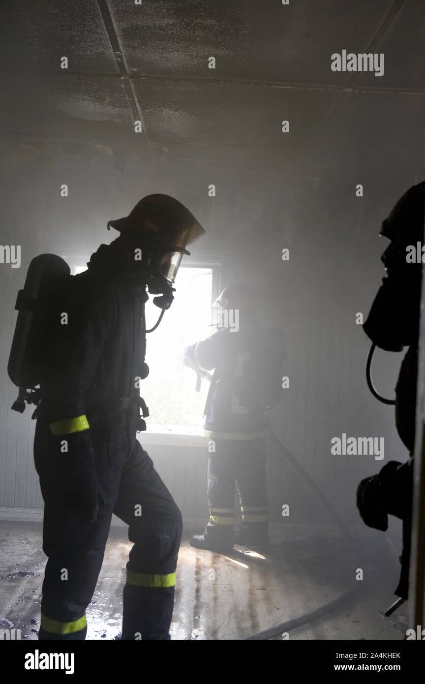 Firemen. Fire drill - oxygen tanks Stock Photo - Alamy