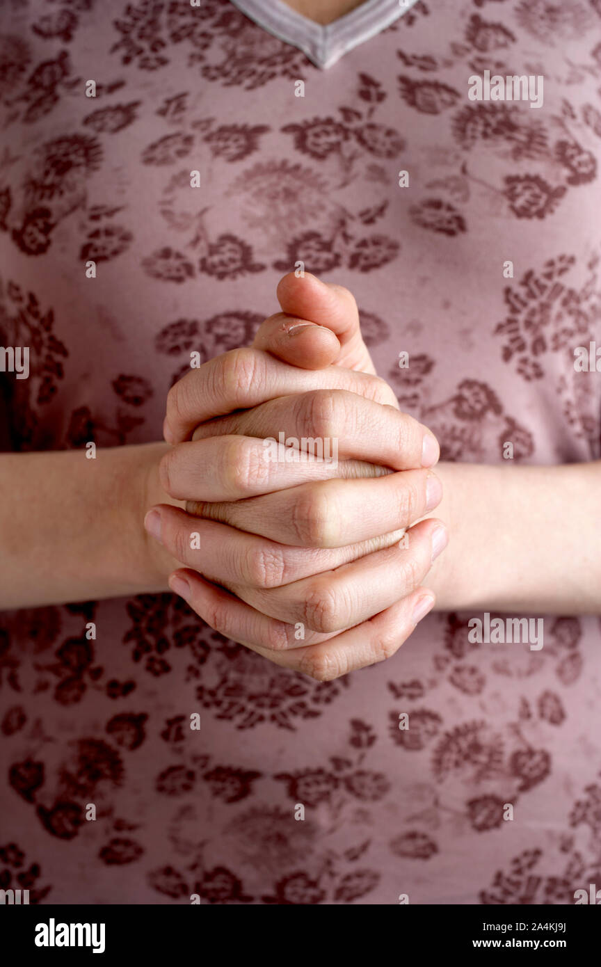 Folded hands praying hi-res stock photography and images - Alamy
