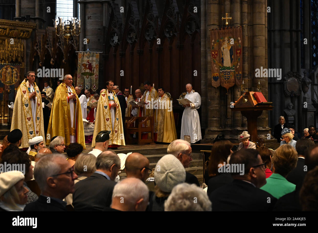 Dean of Westminster John Hall (centre) addresses a service at ...