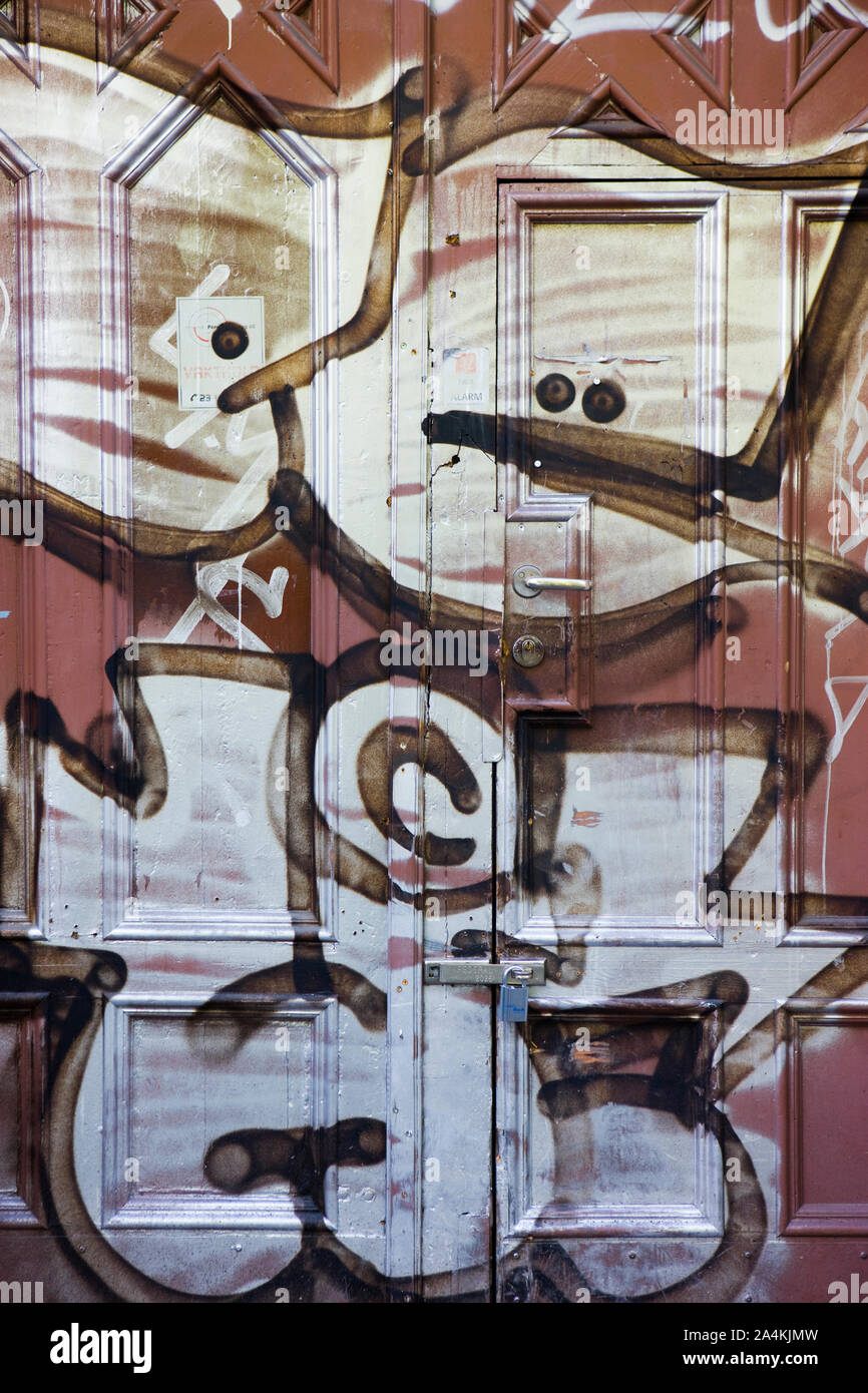 Graffiti on city house gate Stock Photo - Alamy
