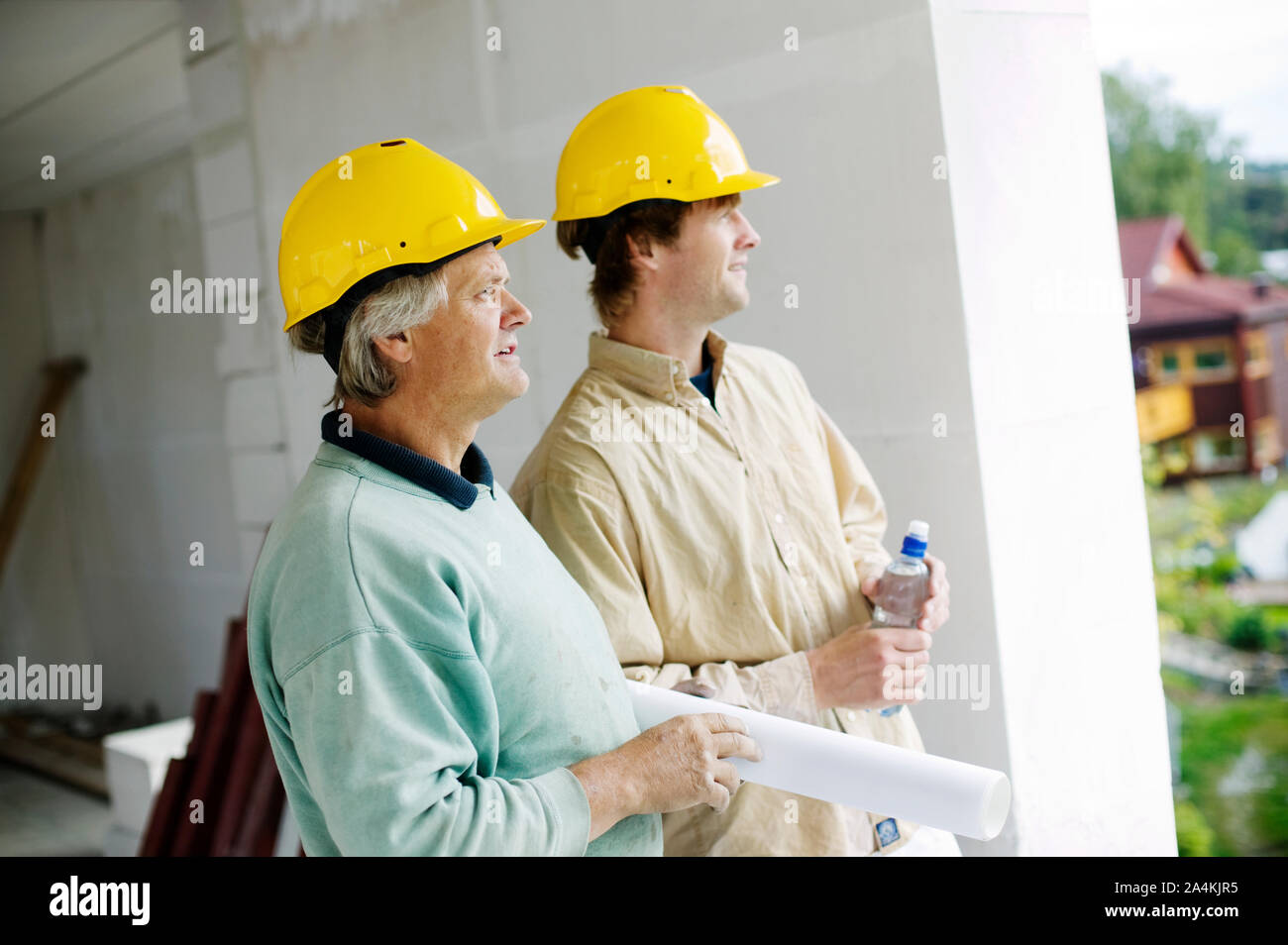 Two men at a construction site Stock Photo - Alamy