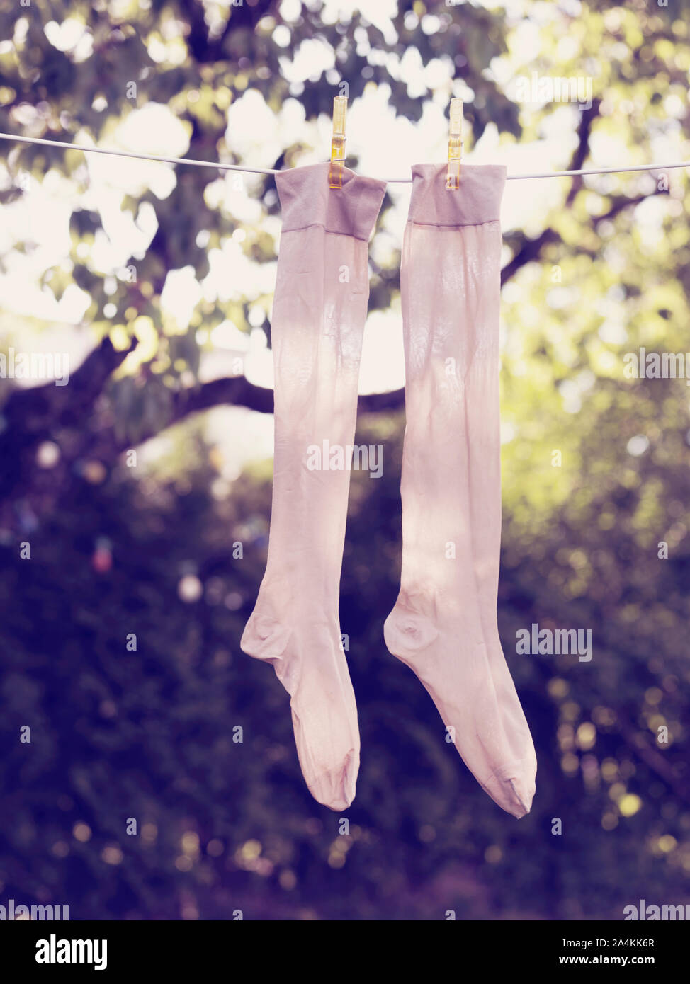 Stockings hanging on clothesline Stock Photo - Alamy