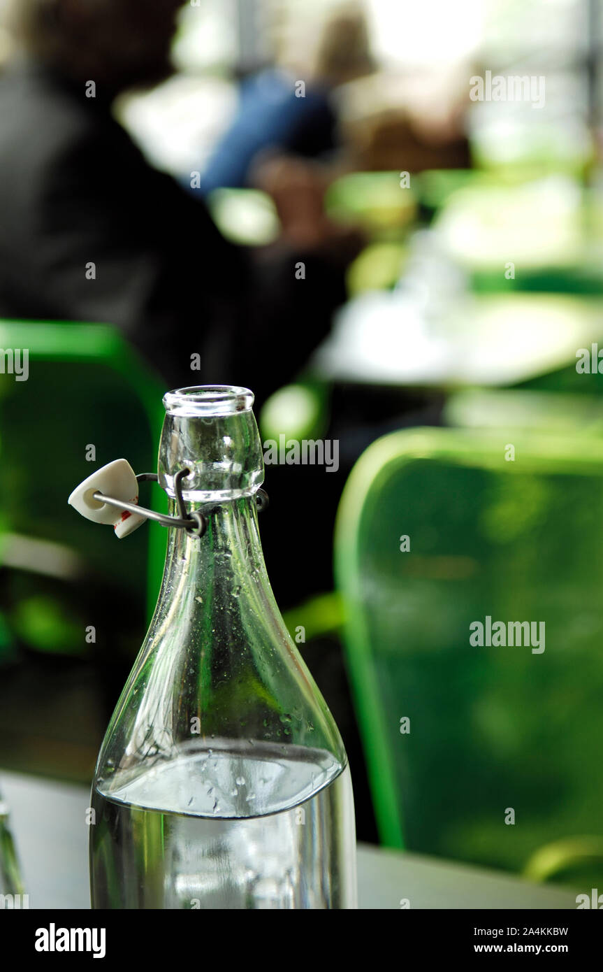 Bottle of water in café Stock Photo - Alamy
