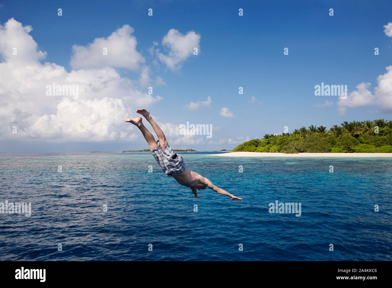 Man diving in Maldives Stock Photo - Alamy