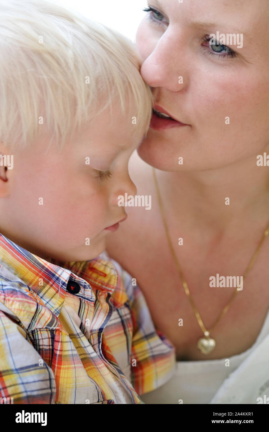 Mother comforting child Stock Photo - Alamy