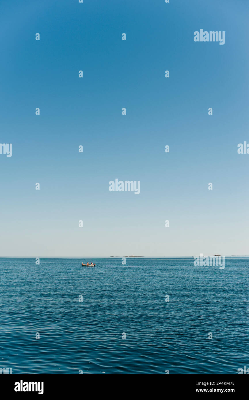 Small boat at sea Stock Photo - Alamy