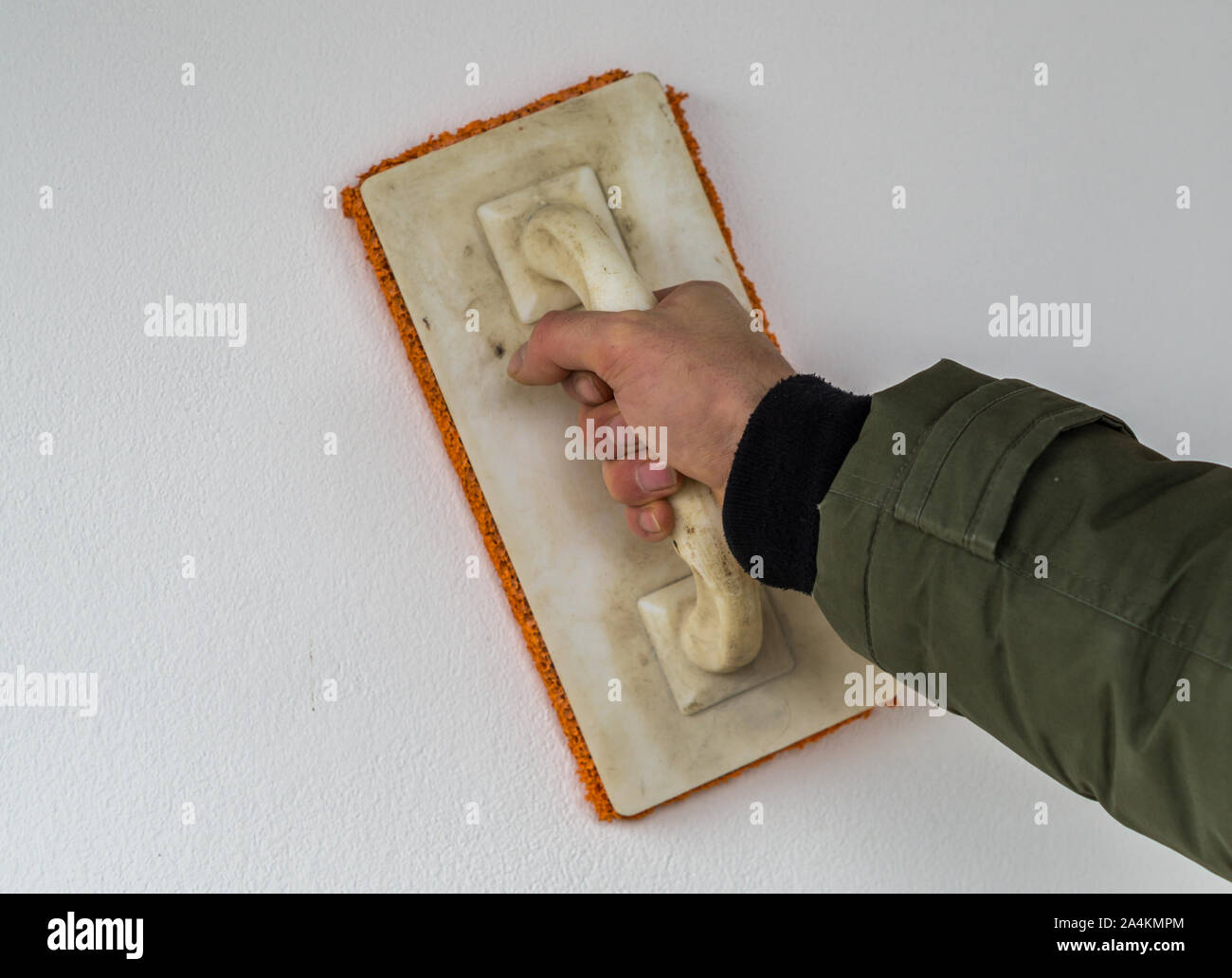 Worker with the wall plaster Stock Photo - Alamy