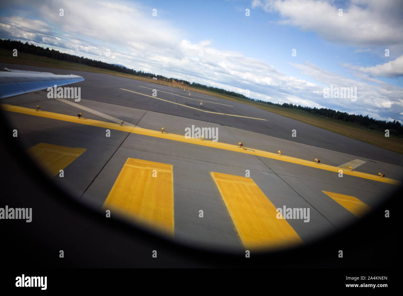 Airplane window. Runway view Stock Photo - Alamy