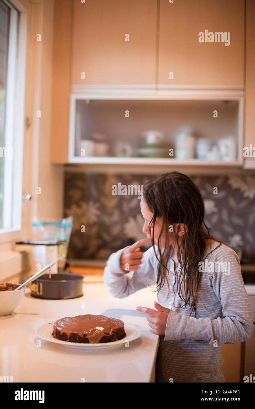 Girl making chocolate cake Stock Photo - Alamy