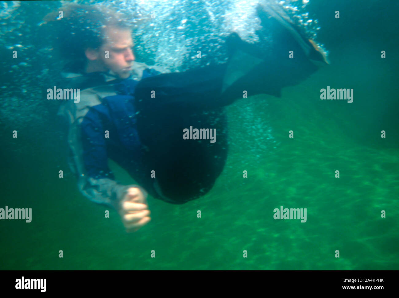 Person Falling Underwater