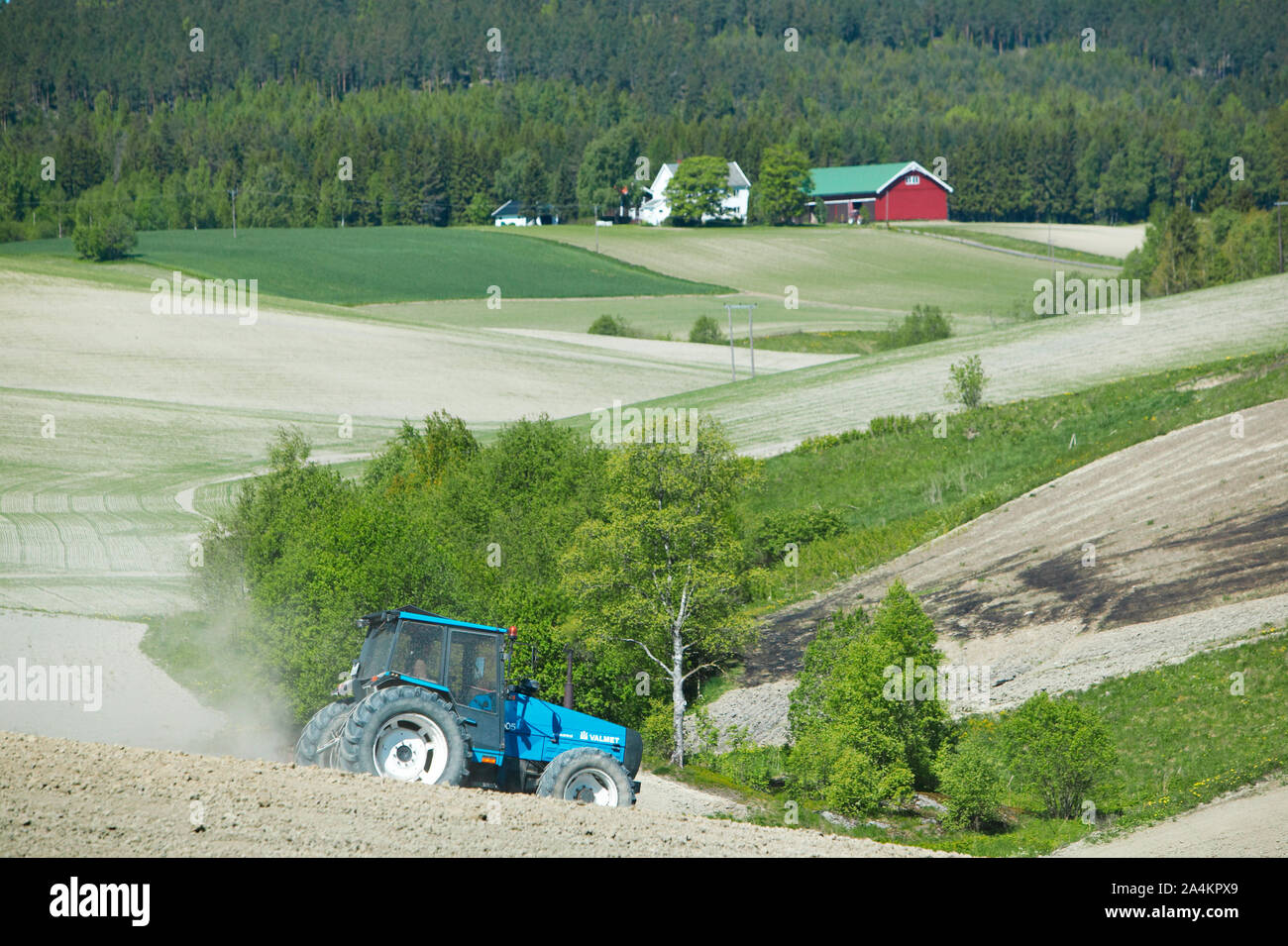Norwegian farm and tractor Stock Photo - Alamy