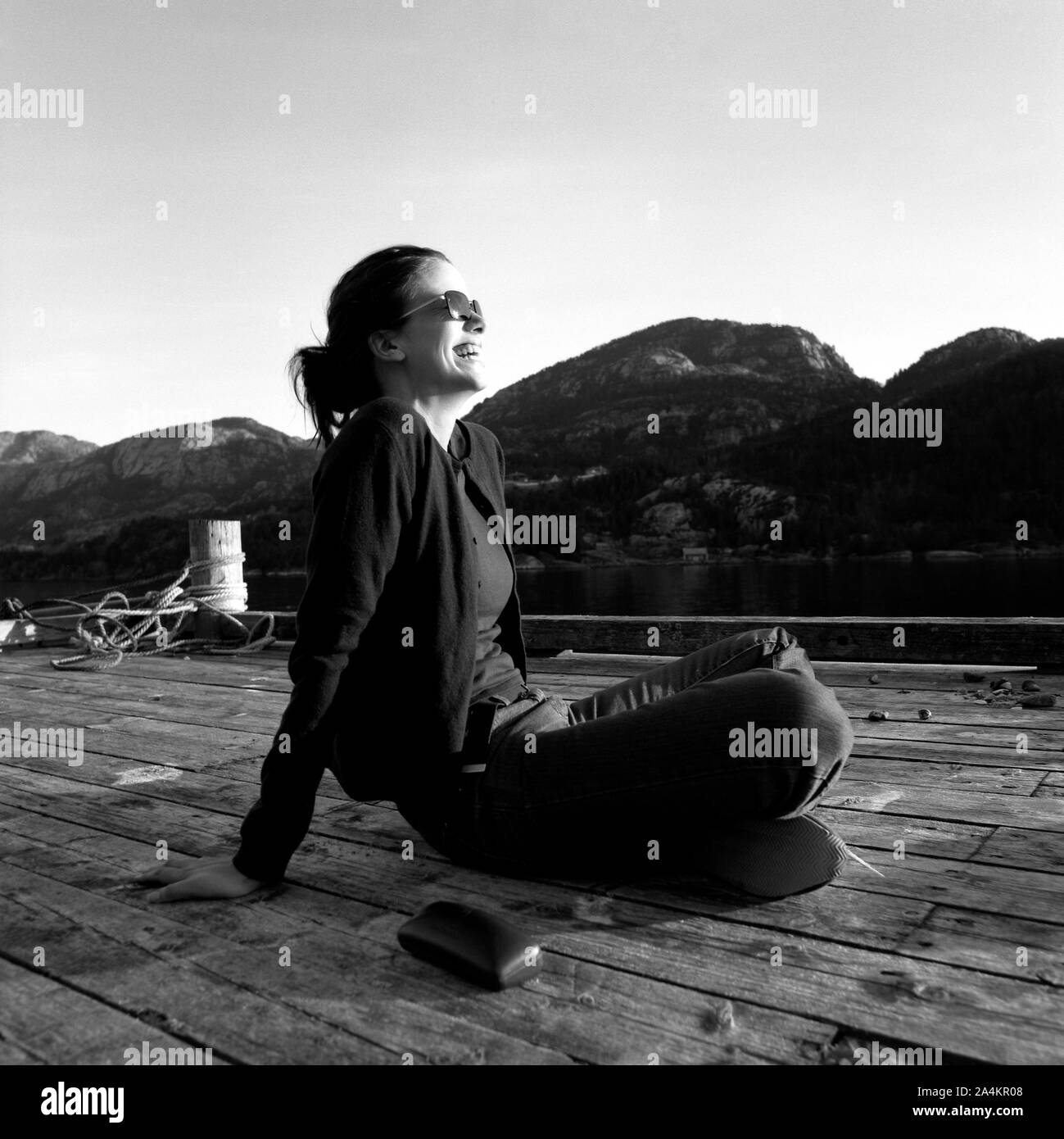 Woman crossed legs Black and White Stock Photos & Images - Alamy