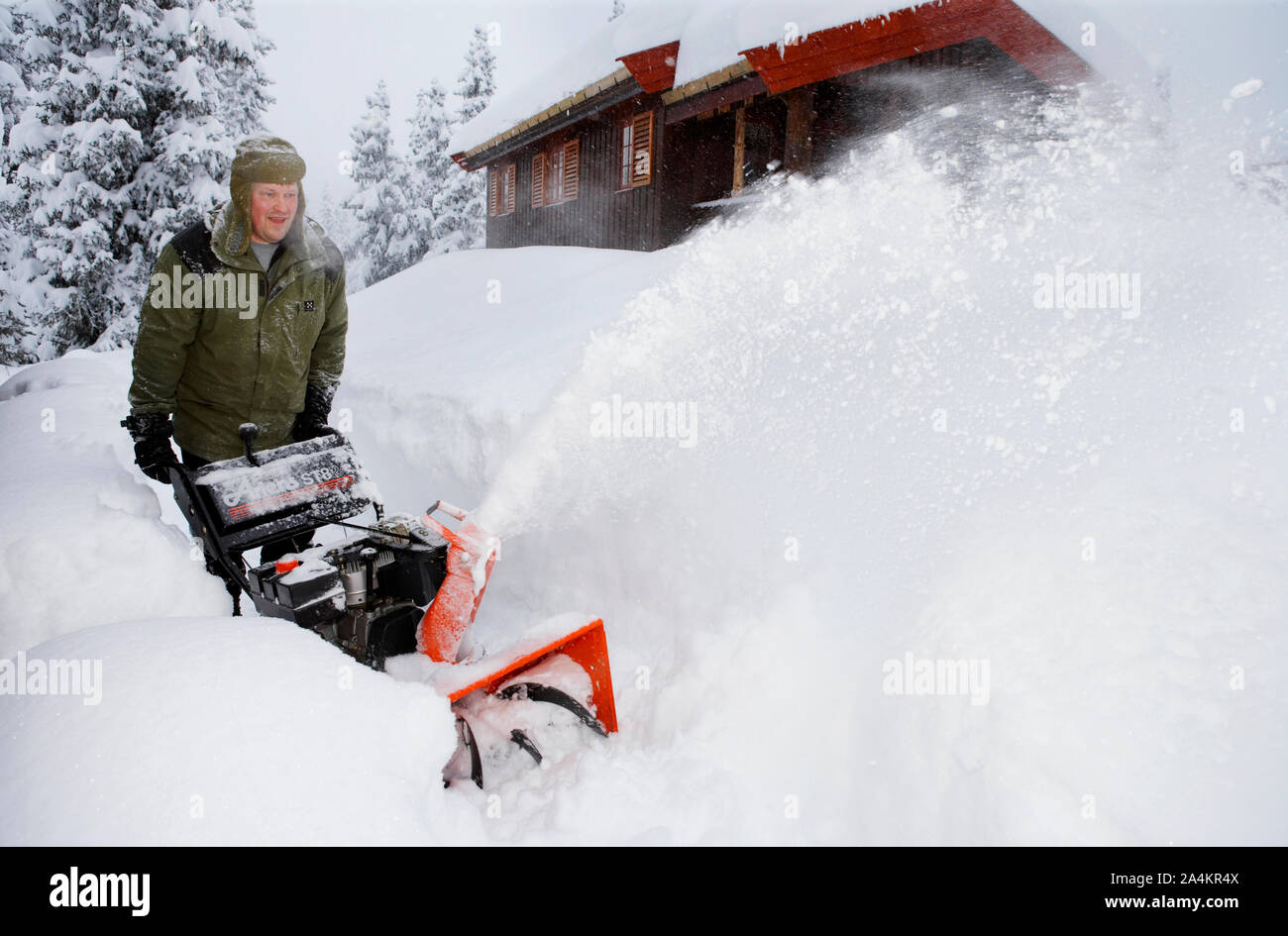 Man operating a snow blower/snowblower Stock Photo - Alamy
