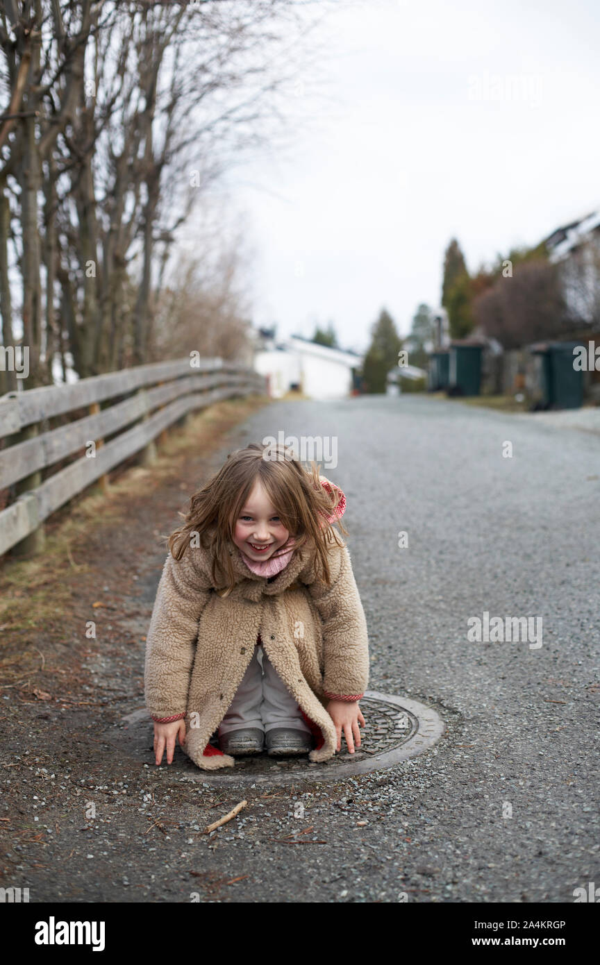 Girl in the road Stock Photo - Alamy