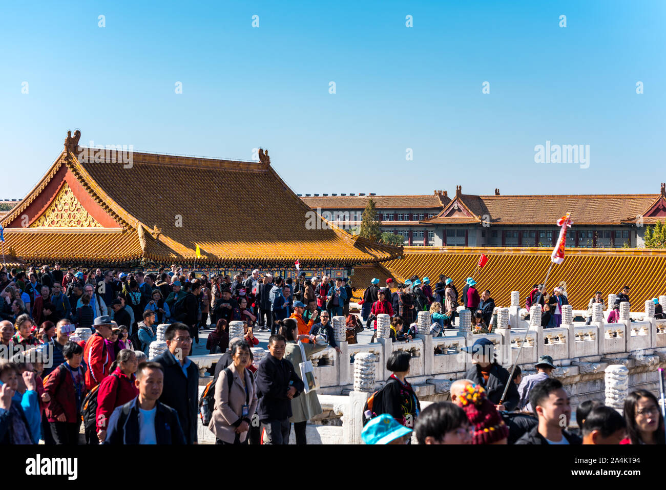 A lot of tourists inside of the Forbidden City, the main buildings of ...