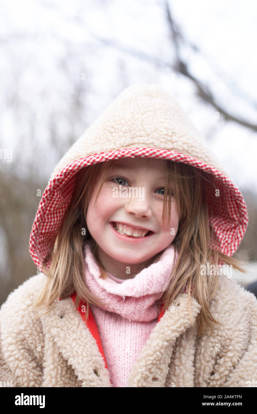 Smiling girl - portrait in hood Stock Photo - Alamy