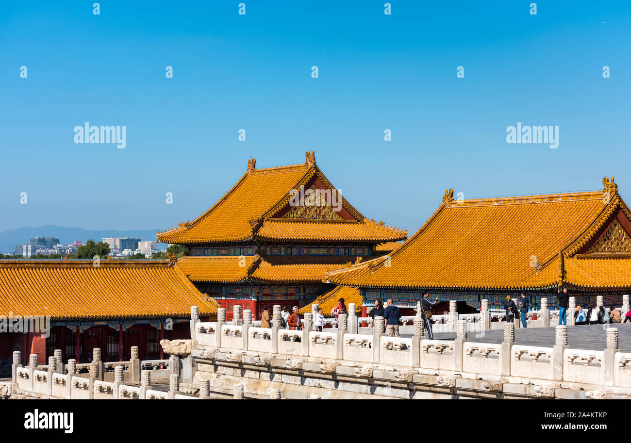 Red wall and golden tiles rooftops of The Forbidden City,the former ...