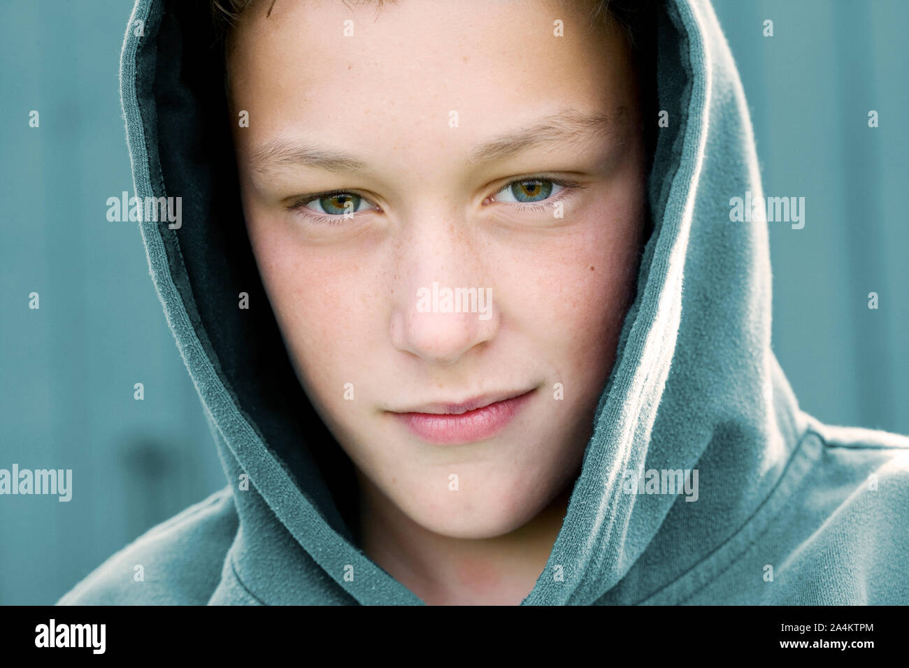 Portrait of young boy with hood Stock Photo - Alamy