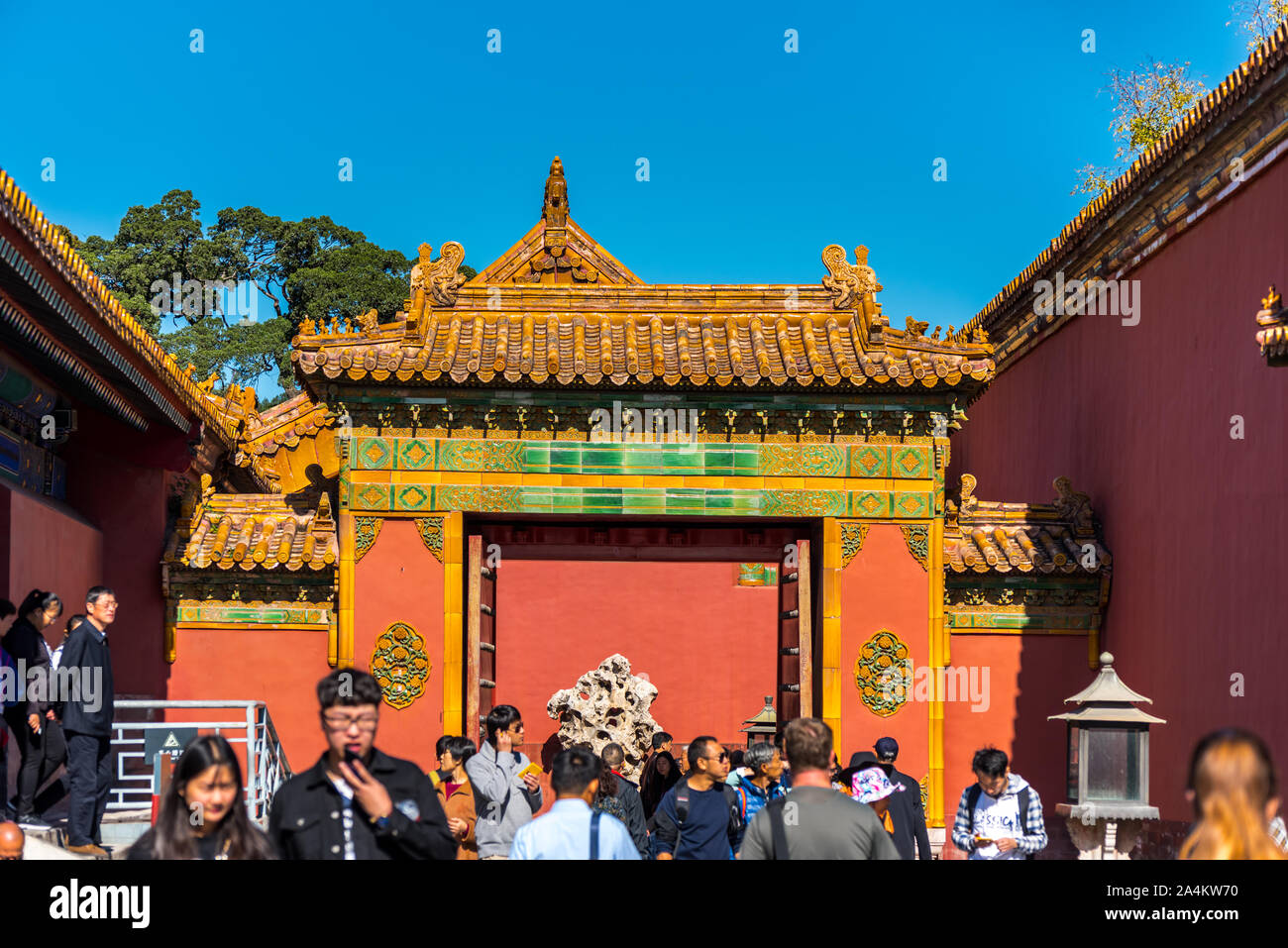 A lot of tourists inside of the Forbidden City, the main buildings of ...