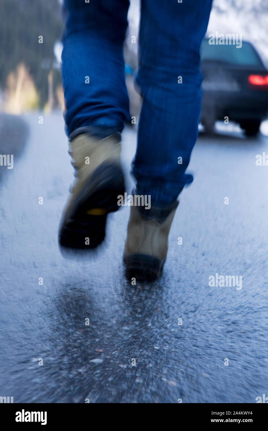 Man walking along road. Leaving Stock Photo - Alamy